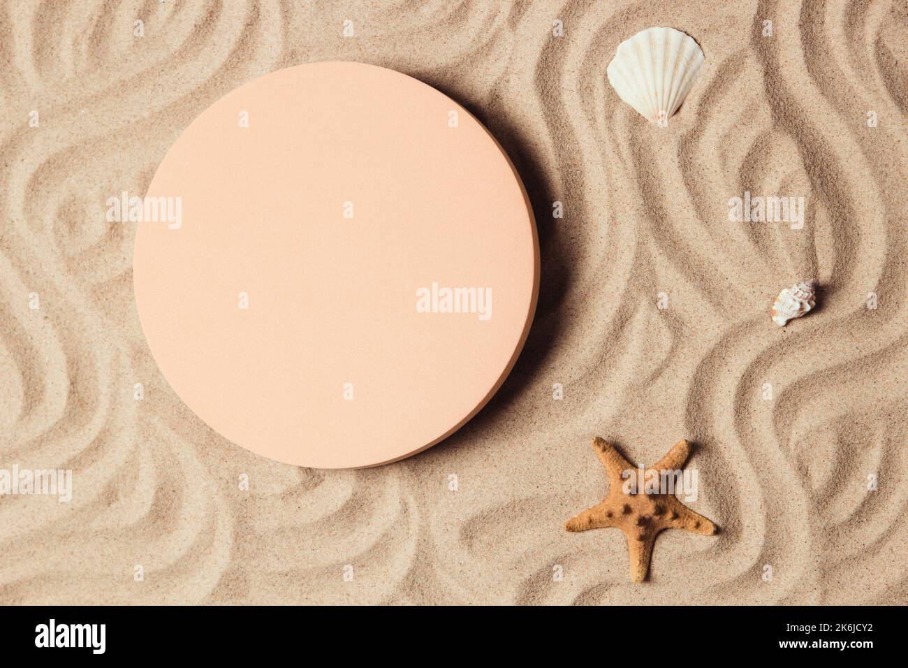 Empty beige round platform podium for cosmetics or products ...