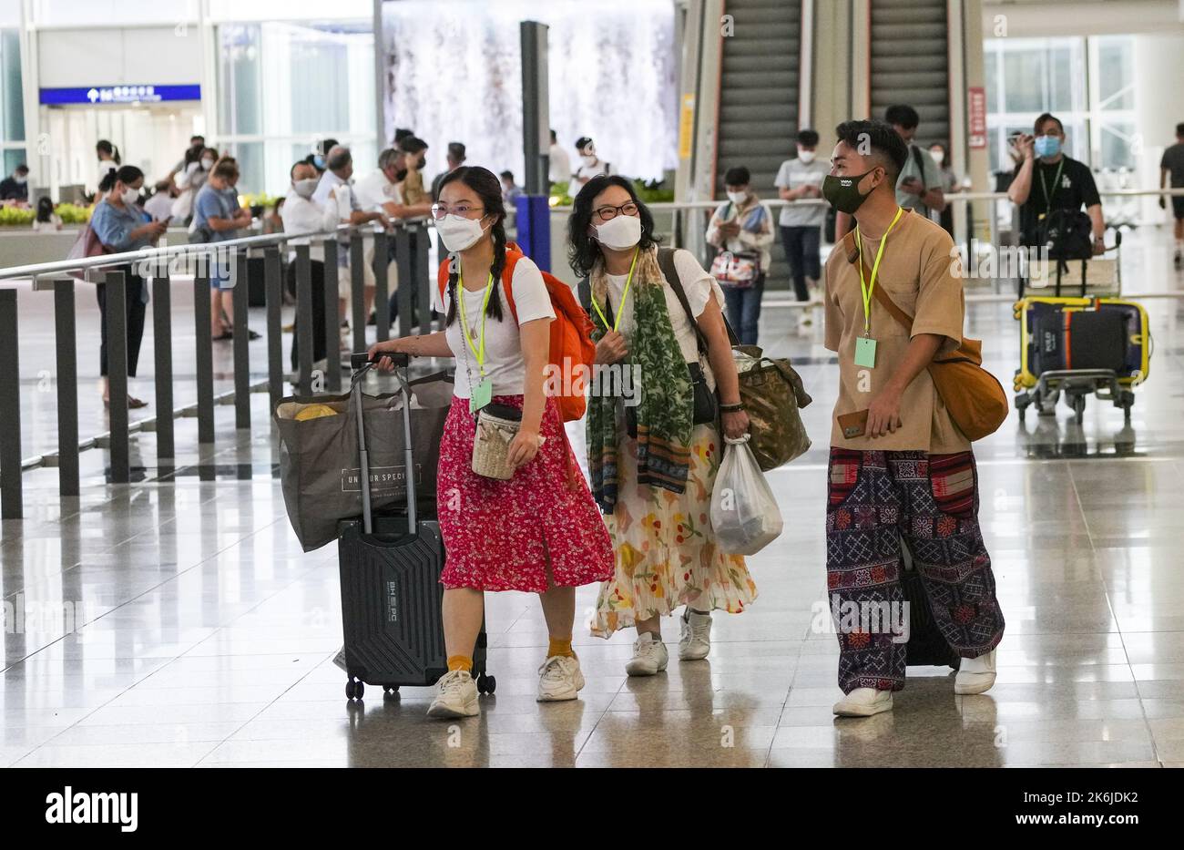 Passengers arrive at Hong Kong International Airport in Chek Lap Kok ...