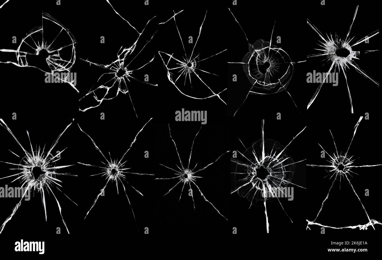 Set of bullet holes on black glass. Cracked texture of a shot window ...