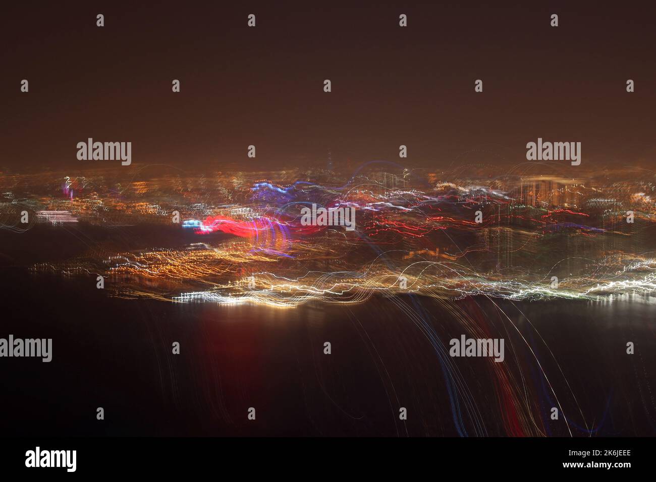 Night photo of the city of Doha from an airplane. Camera shift for ...