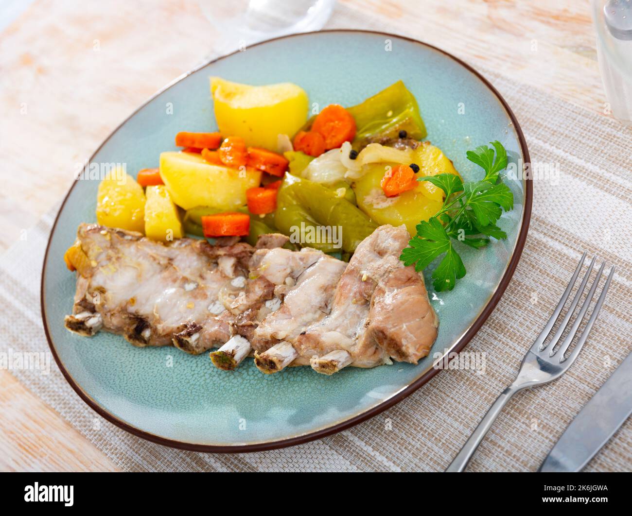 Stewed pork ribs with potato and vegetables Stock Photo - Alamy