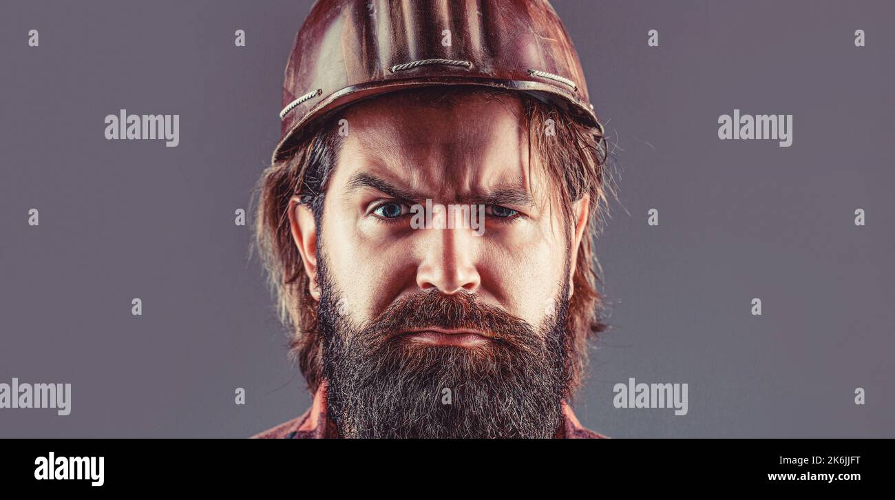 Bearded man worker with beard in building helmet or hard hat. Man ...