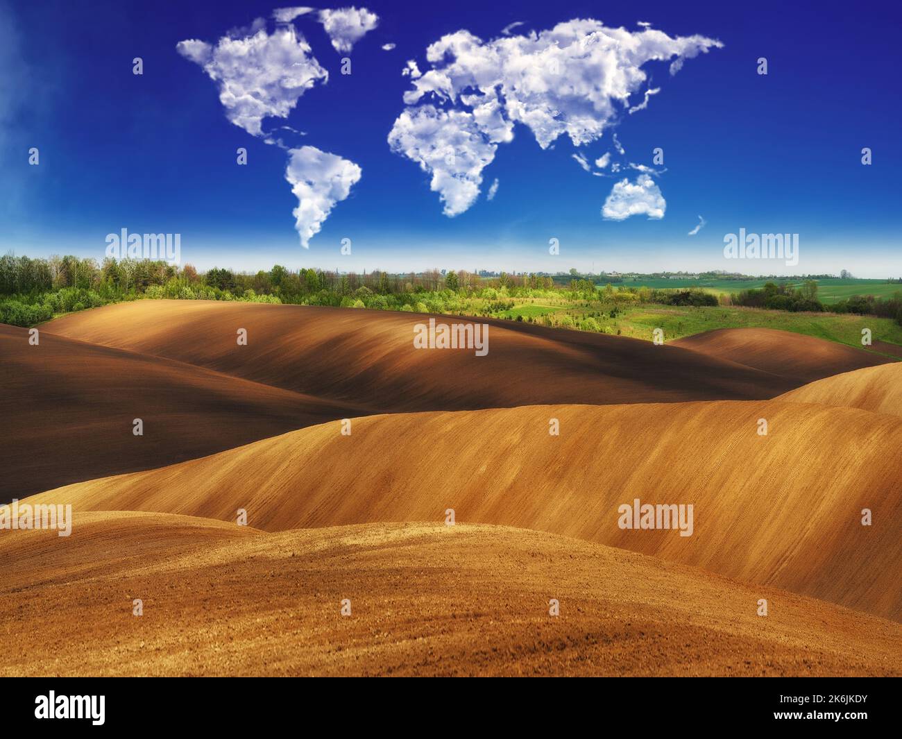 clouds in the form of a map of the world over the field. Travel and ...