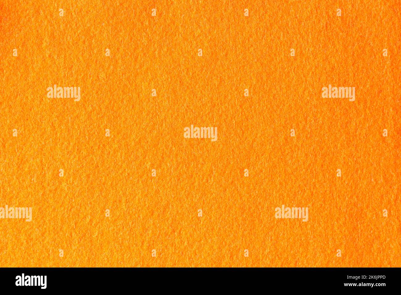 Orange hue color felt textile fabric texture background Stock Photo - Alamy