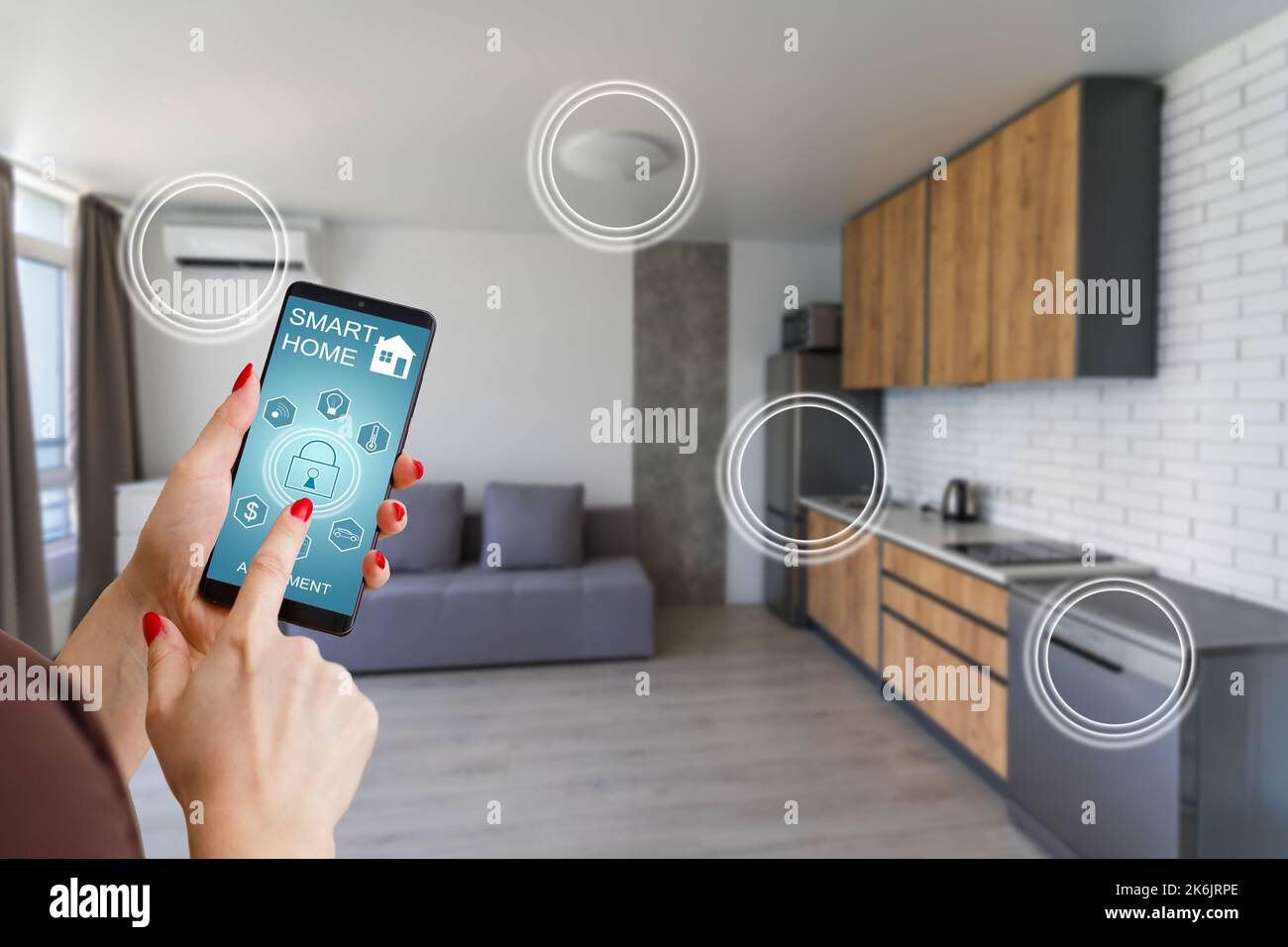 Smart home technology interface on smartphone app screen with augmented reality (AR) view of ...