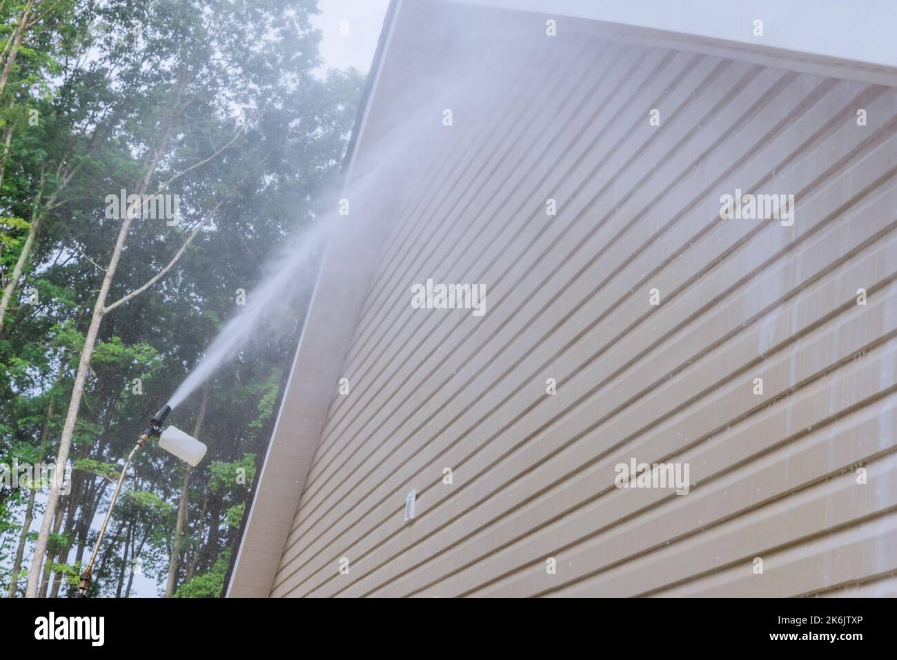 Service that involves cleaning siding houses by using high pressure ...
