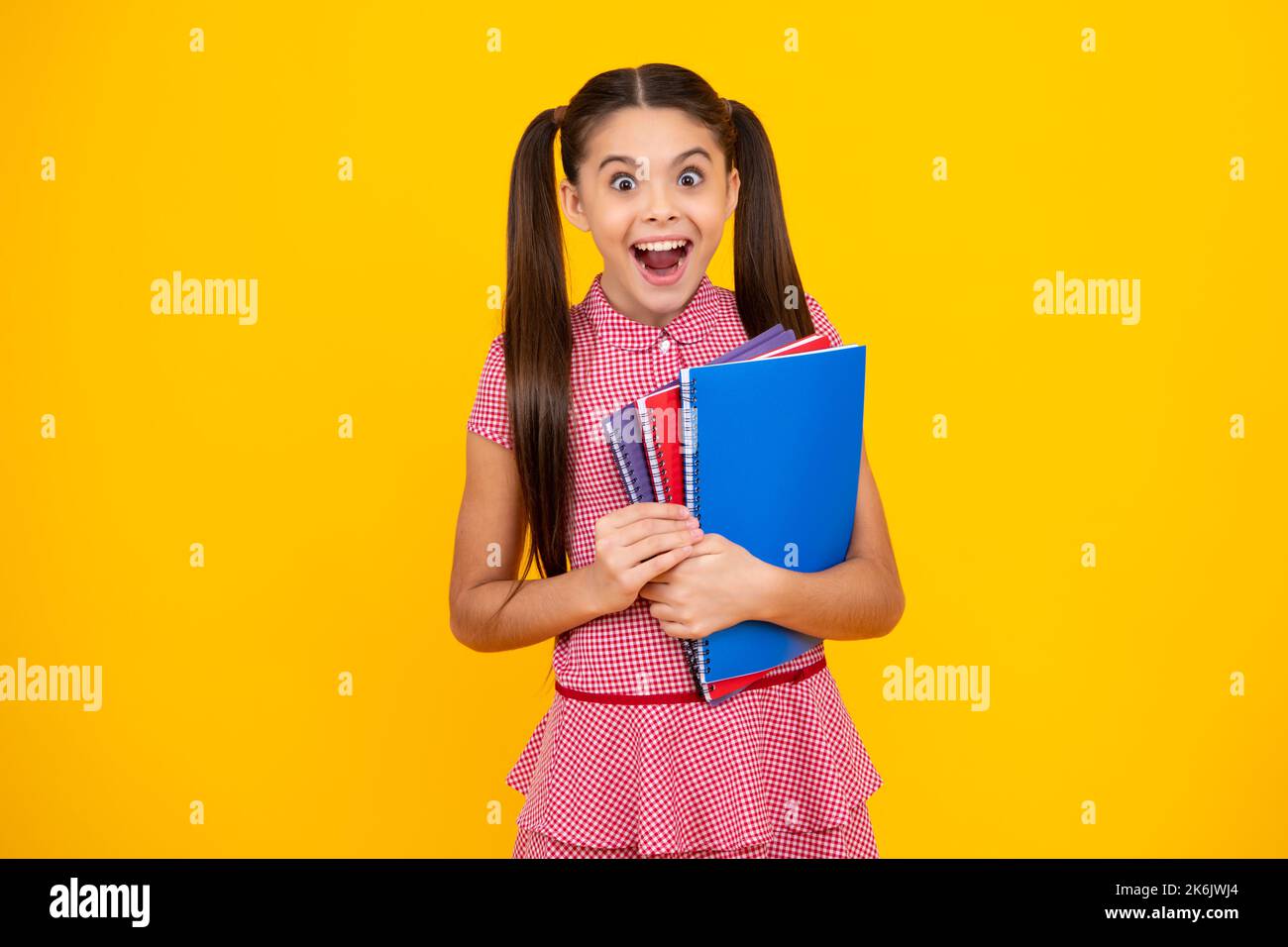 Amazed teenager. Back to school. Portrait of teenage school girl with ...