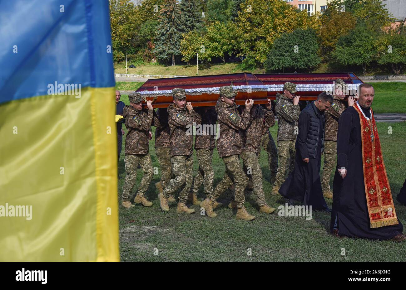 Ukrainian soldiers carry the coffins of their comrades during a funeral ...