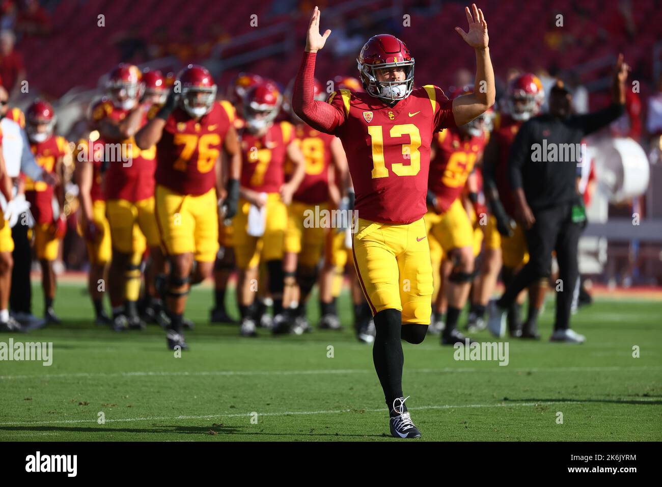 USC Trojans quarterback Caleb Williams (13) raises his arms to indicate ...