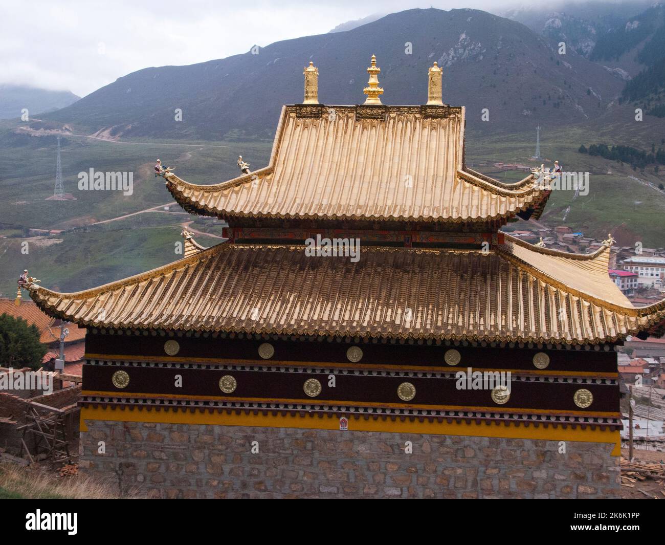 Teared Chinese style roof in gold coloured metal on building hall in ...