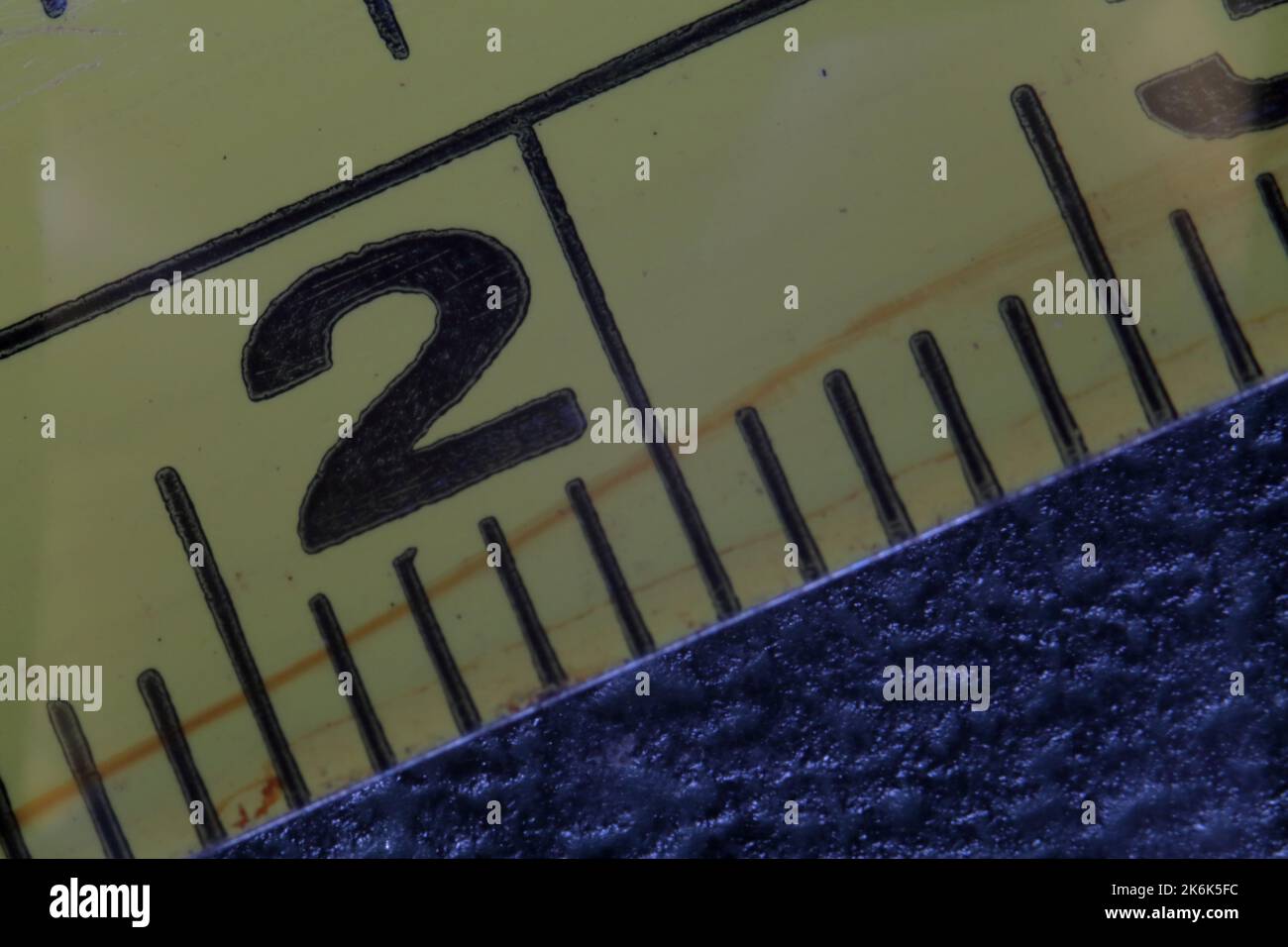 Close-up of the yellow measuring tape indicating the measure two ...