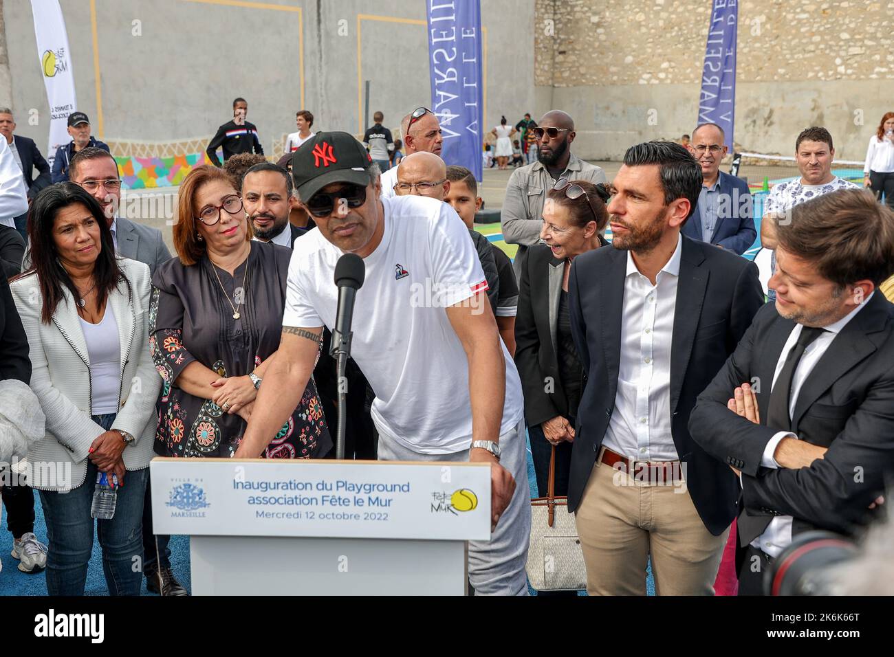 Yannick Noah (C), accompanied by the mayor of Marseille Benoit Payan (R ...