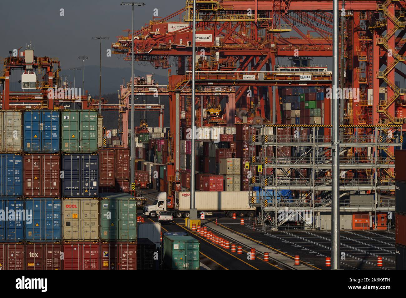 Canada. 14th Oct, 2022. A truck carries a cargo container at the Port ...