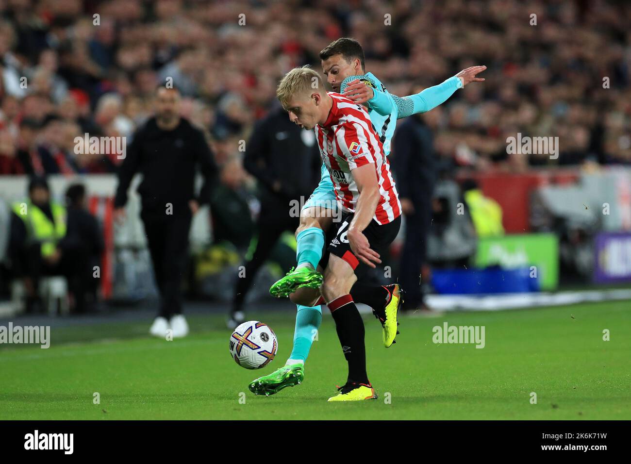 Solly March #7 of Brighton & Hove Albion challenges Ben Mee #16 of ...