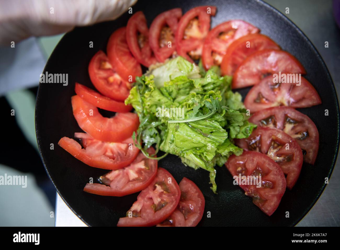 Close-up of the Hands of a Female Chef Making Salad With Meat and ...