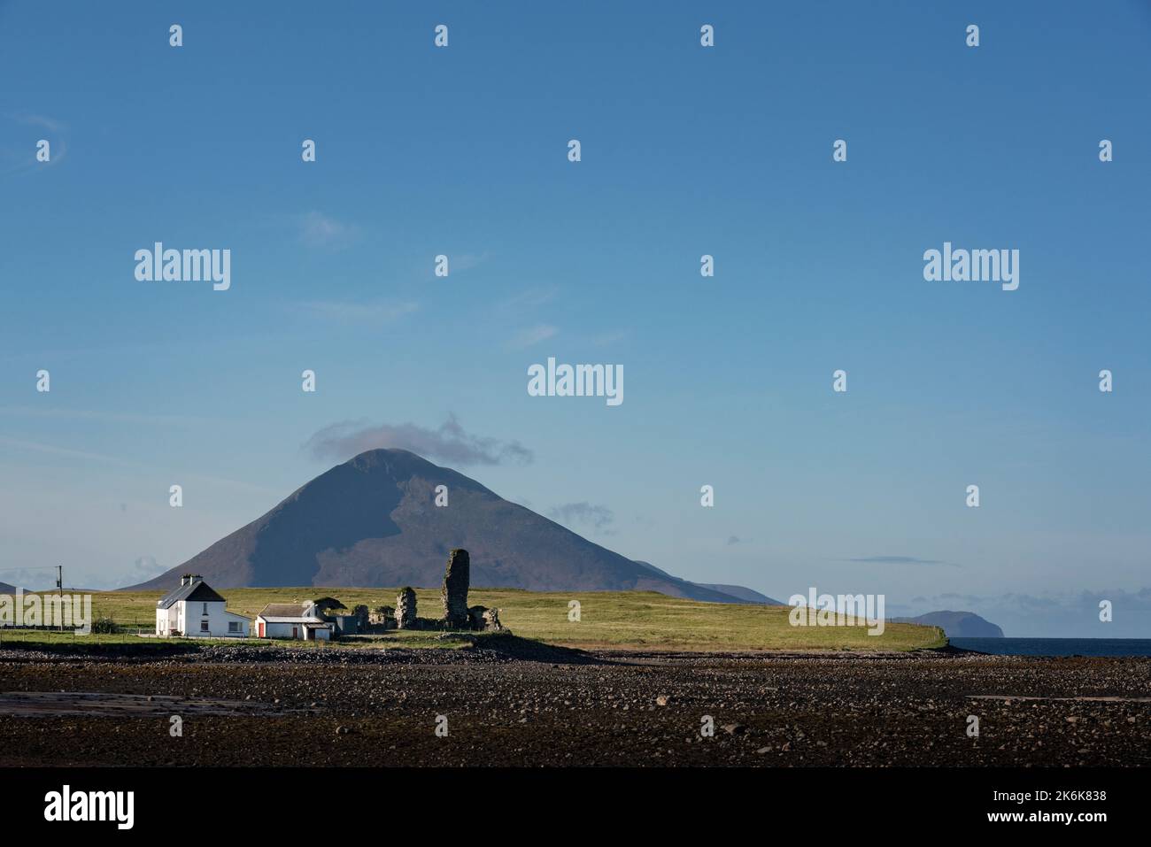 Ruins of Fahy Castle at Tullaghan Bay, seen from Doona Beach at low ...