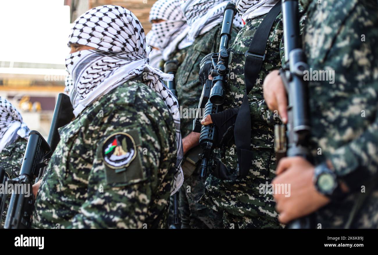 Members of the Palestinian Military factions seen on guard during a ...
