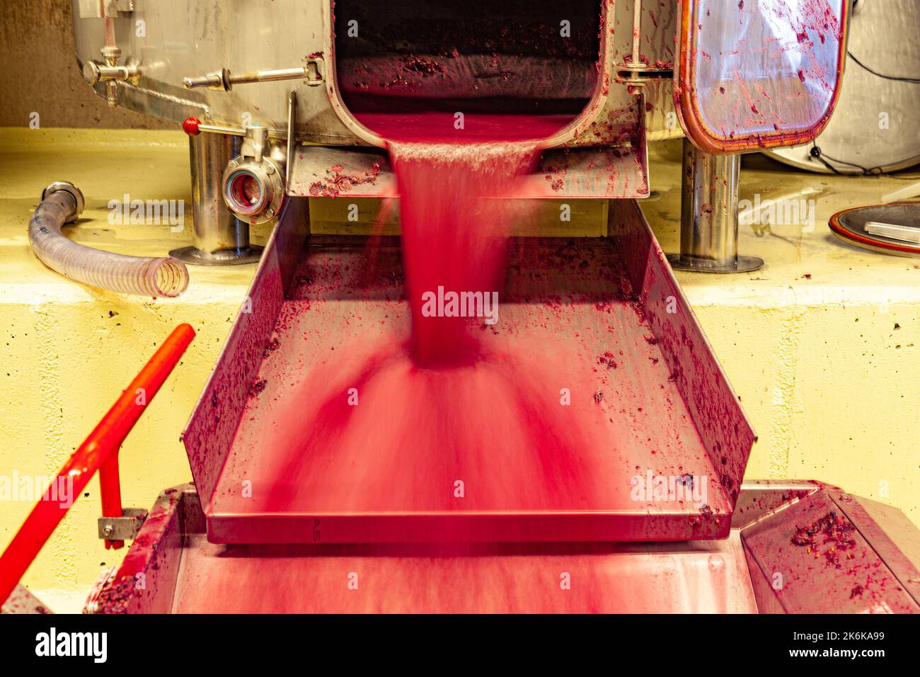 Devatting a tank of red wine Stock Photo - Alamy