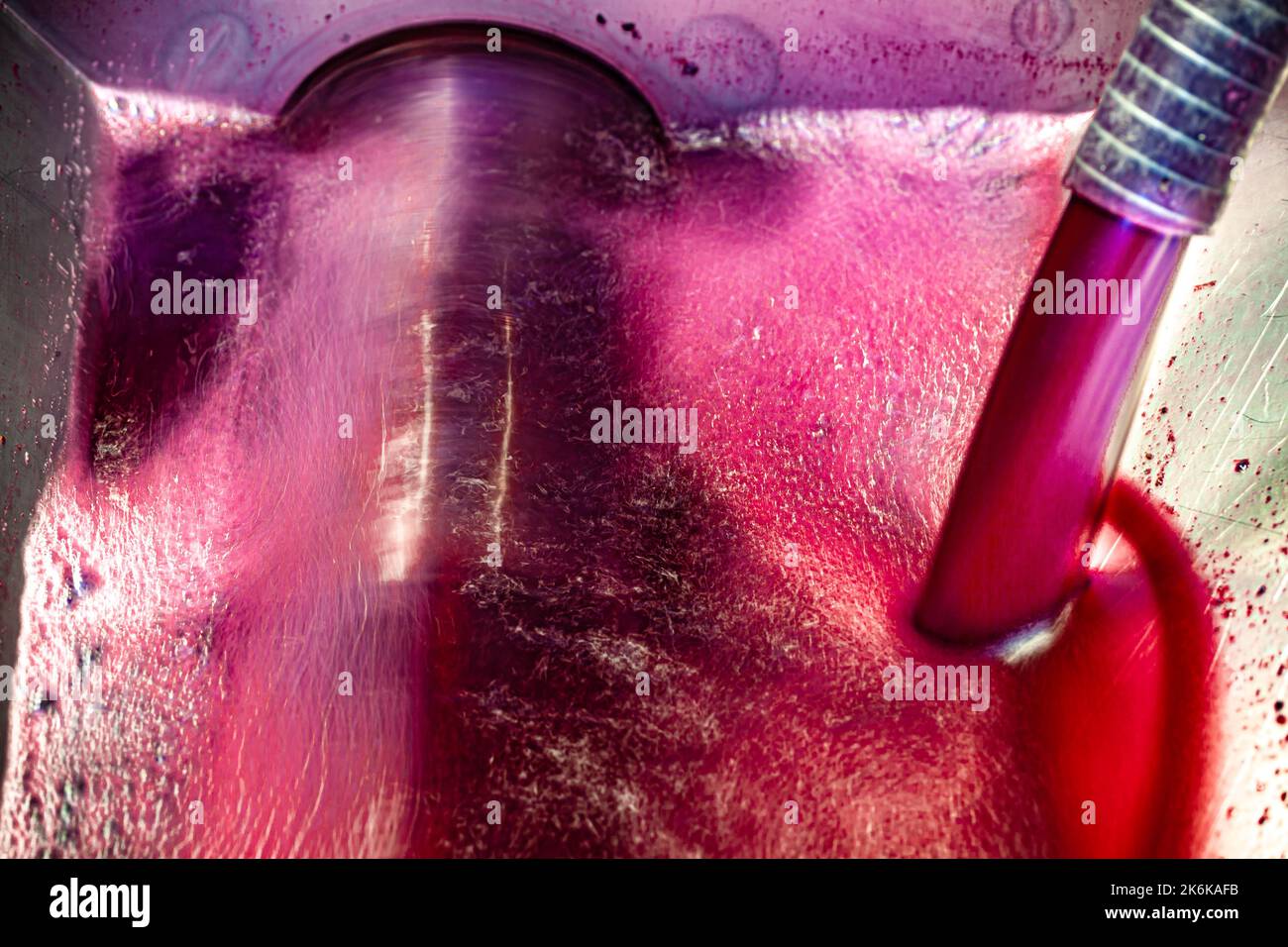 Devatting a tank of red wine Stock Photo - Alamy