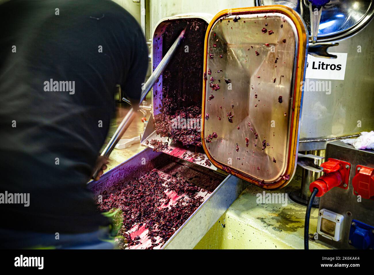 Devatting a tank of red wine Stock Photo - Alamy