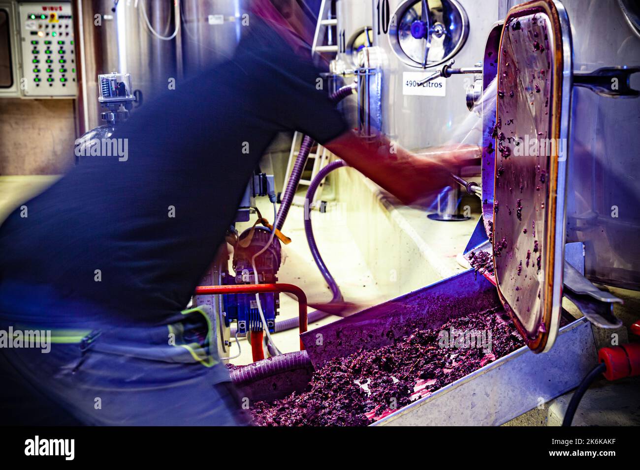 Devatting a tank of red wine Stock Photo - Alamy