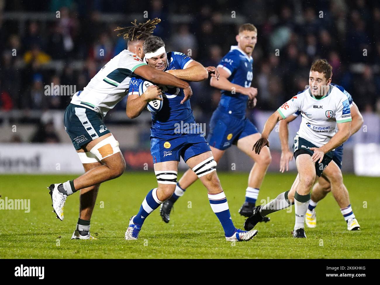 London Irish's Chandler Cunningham-South (left) tackles Sale Sharks ...