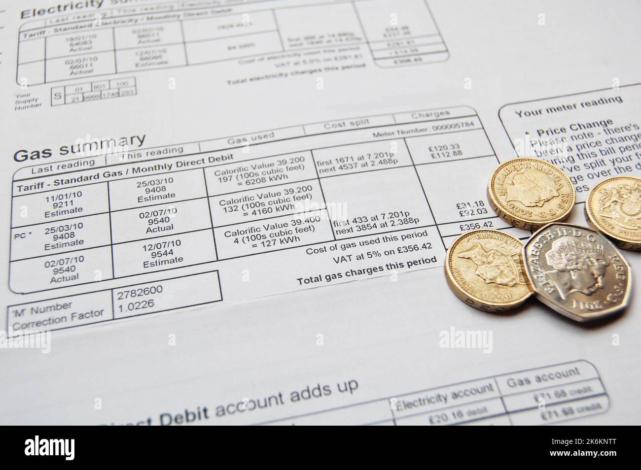 utility bill and coins for payment Stock Photo - Alamy