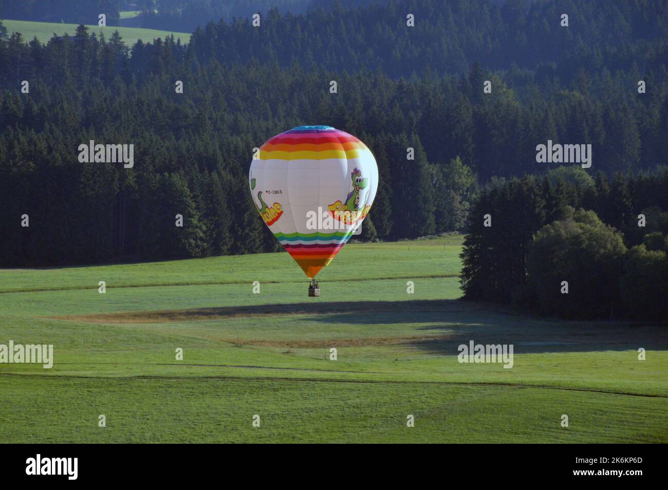 Germany, Upper Bavaria: D-OBKS Kubicek BB.34E hot-air balloon landing ...