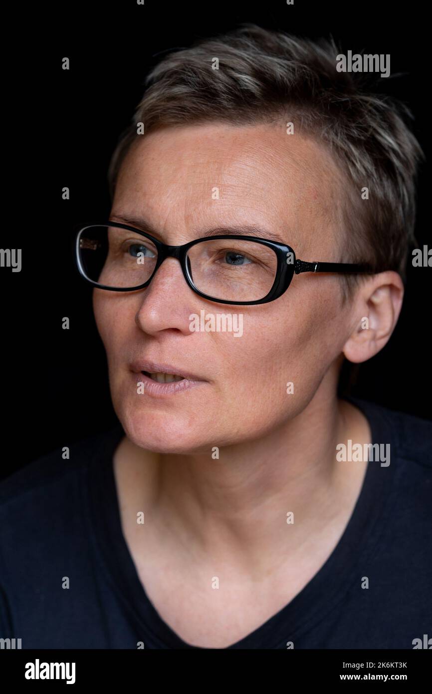 Portrait Of Caucasian Woman With Short Haircut And Black Rimmed Glasses