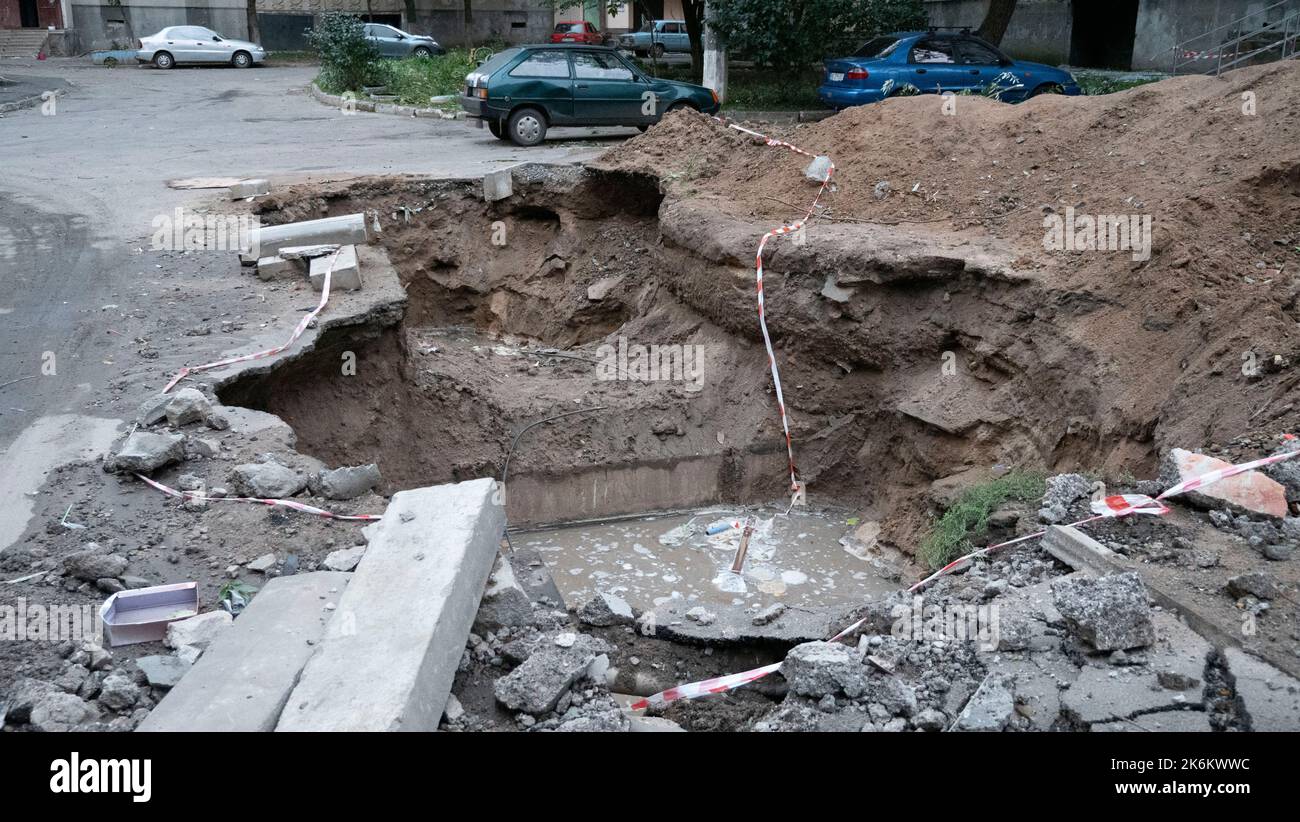 An hole in the ground after an apartment building was destroyed after a ...