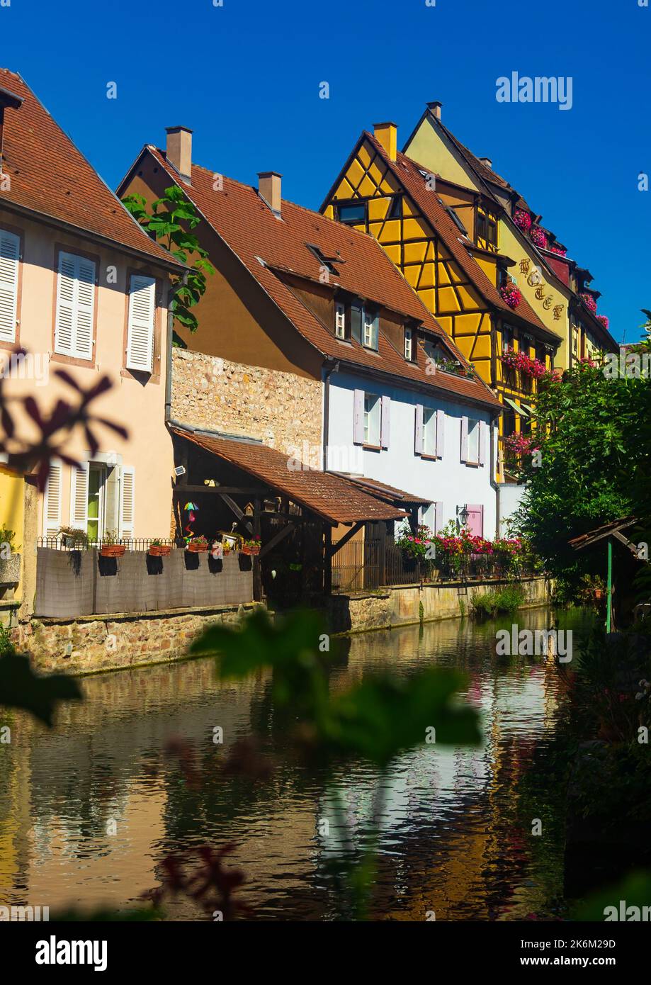 Colorful medieval facades reflecting in water, Colmar, France Stock ...