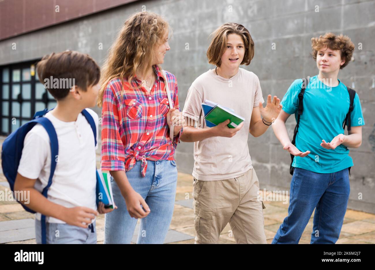 School friends walk after class Stock Photo - Alamy