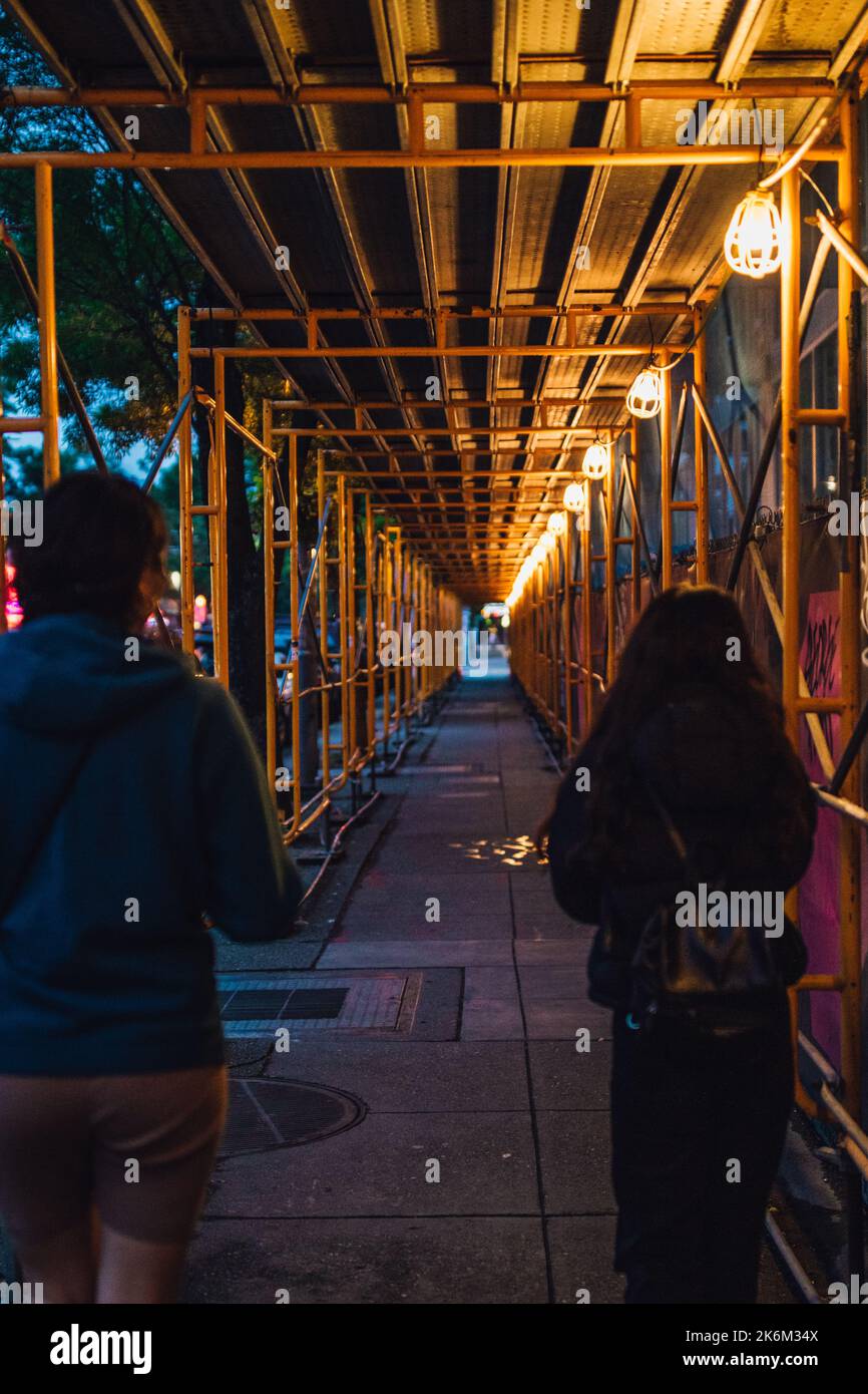 Walking down street lights hi-res stock photography and images - Alamy