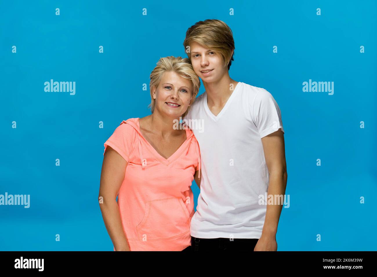 Family portrait. Smiling mother and son wearing casual clothing Stock Photo - Alamy