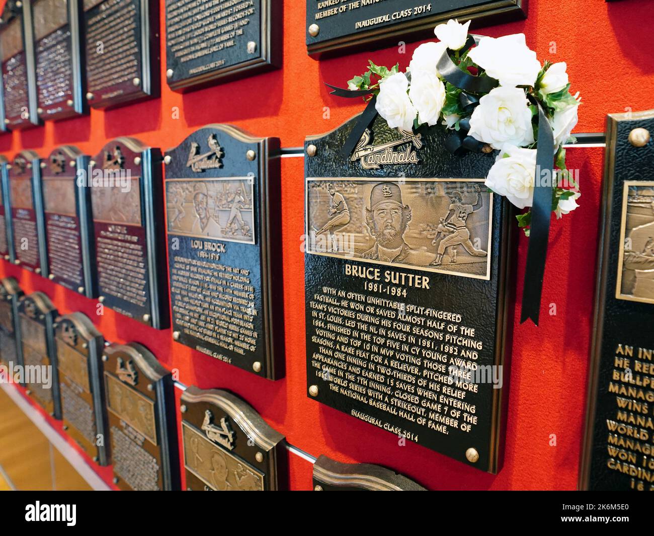 St. Louis, United States. 14th Oct, 2022. Flowers adorn the plaque of ...