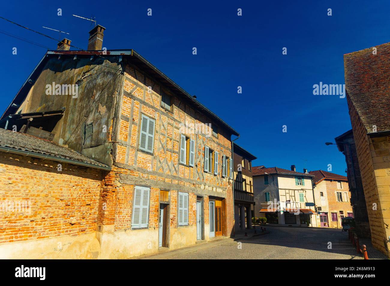 Old houses along streets of Saint-Trivier-de-Courtes, Ain department ...