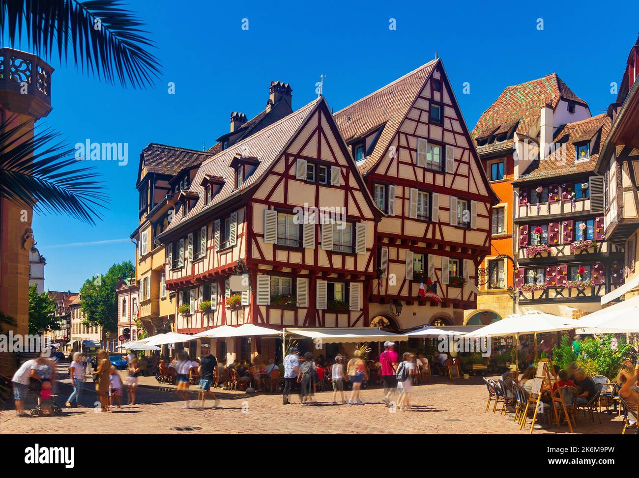 Historic center of Colmar with paved streets and half-timbered houses ...