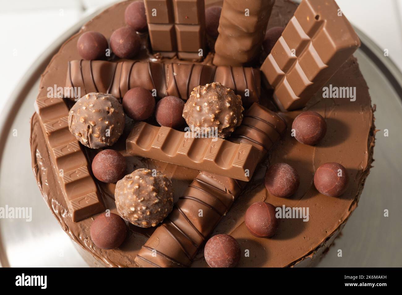 details of decoration with chocolate on a cake, appetizing treat in ...