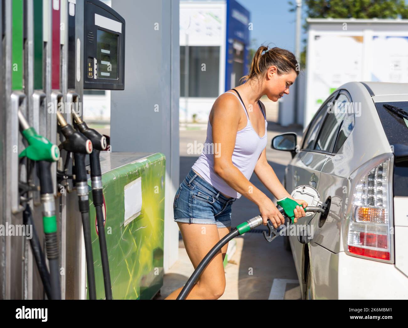 Woman filling up tank hi-res stock photography and images - Alamy