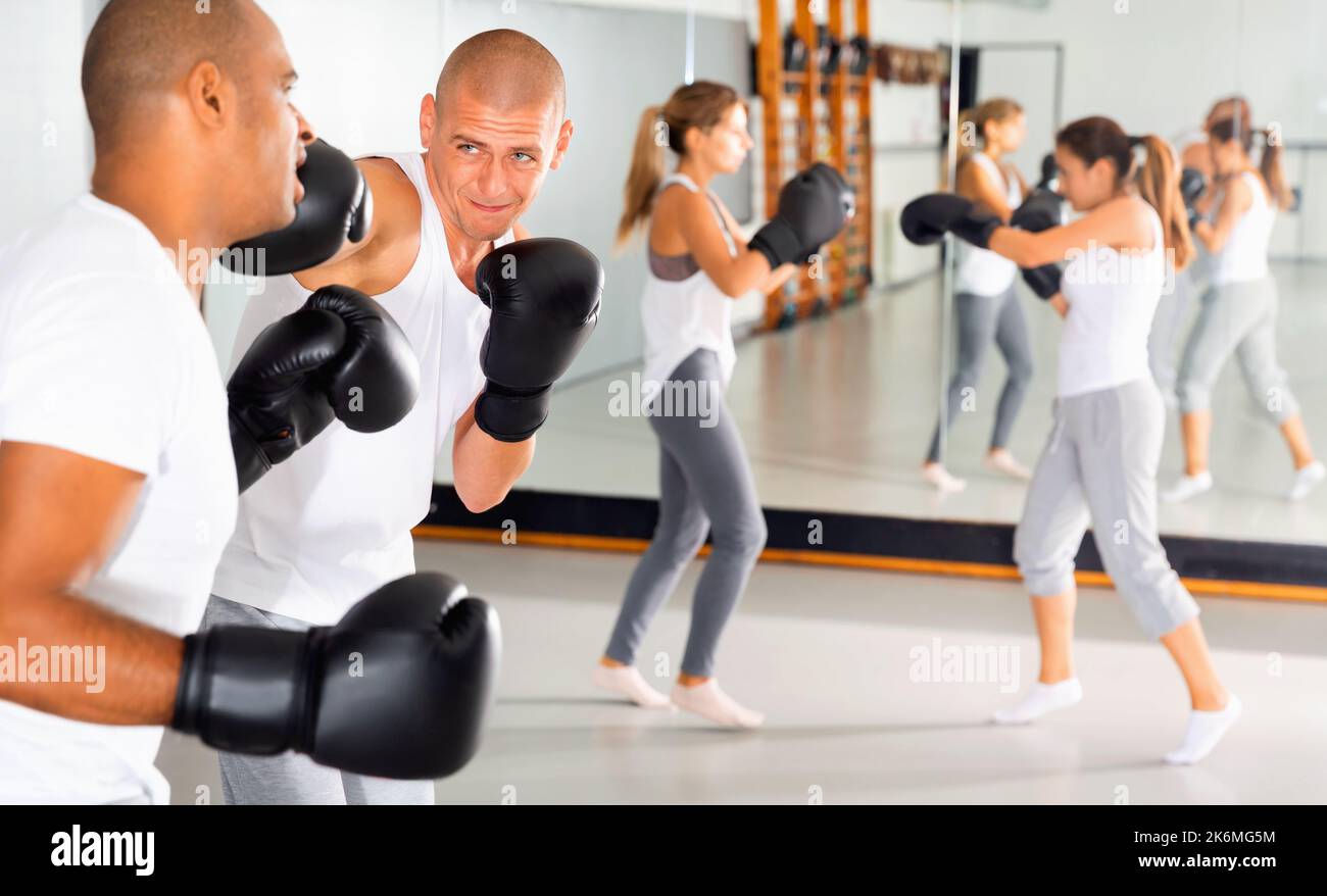 Two men practicing self defense techniques in sports club Stock Photo ...