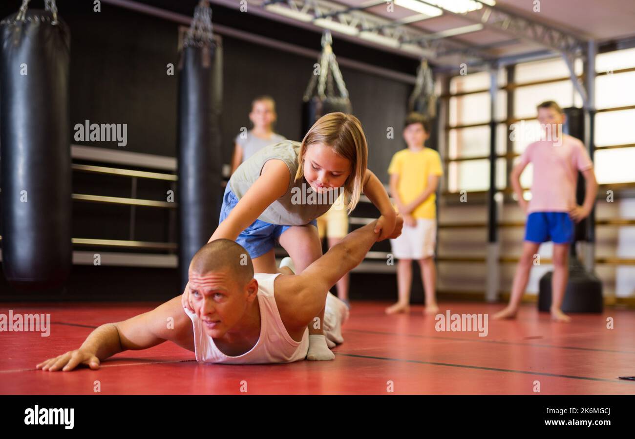 Young schoolgirl practicing basic self-defense moves Stock Photo - Alamy