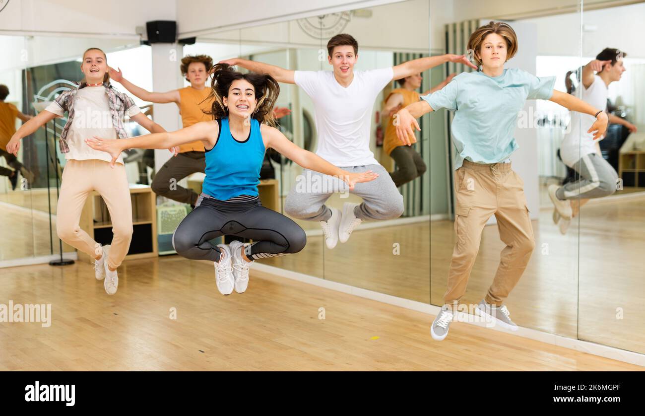Teenagers dancers jumping in studio Stock Photo - Alamy