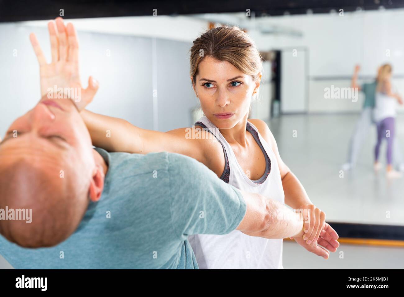 Woman practicing basic palm strike in self defense training Stock Photo ...