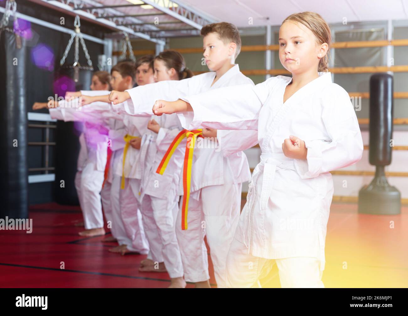 Children wearing karate uniform practicing new moves in group Stock ...