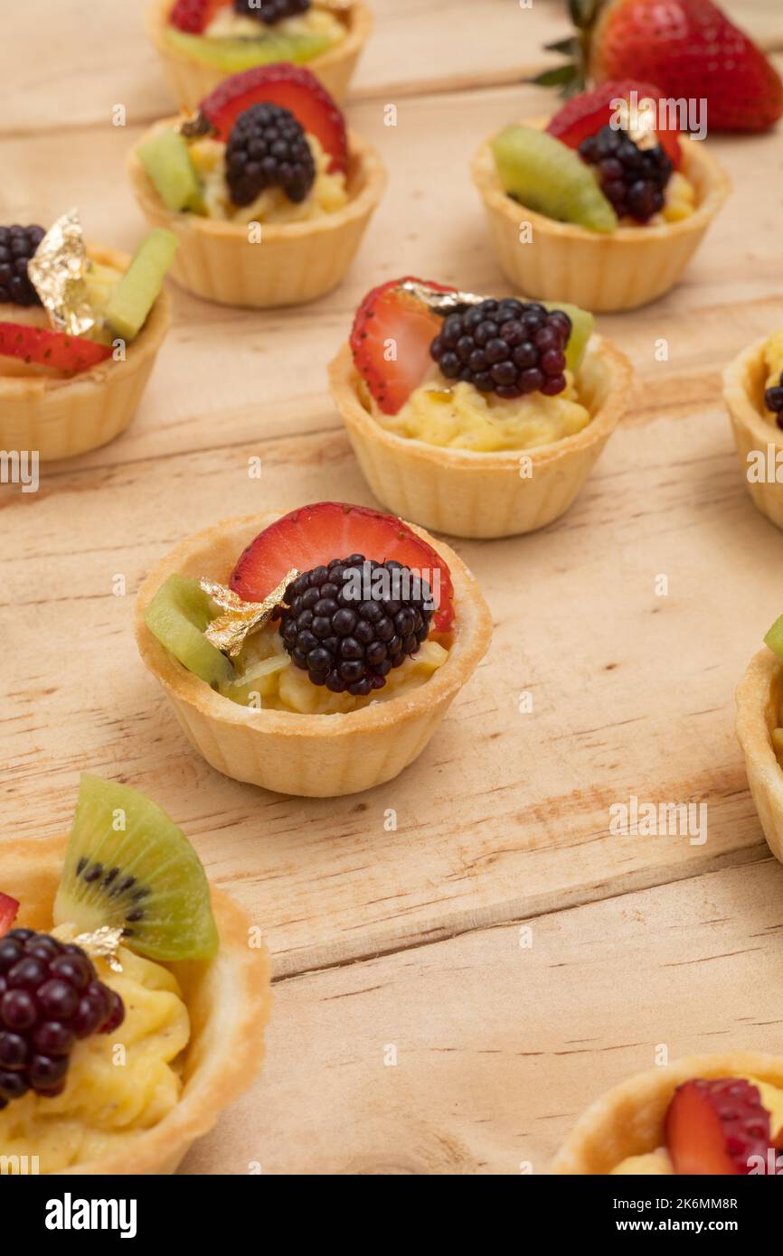 appetizers decorated with tropical fruits and cream, catering service ...