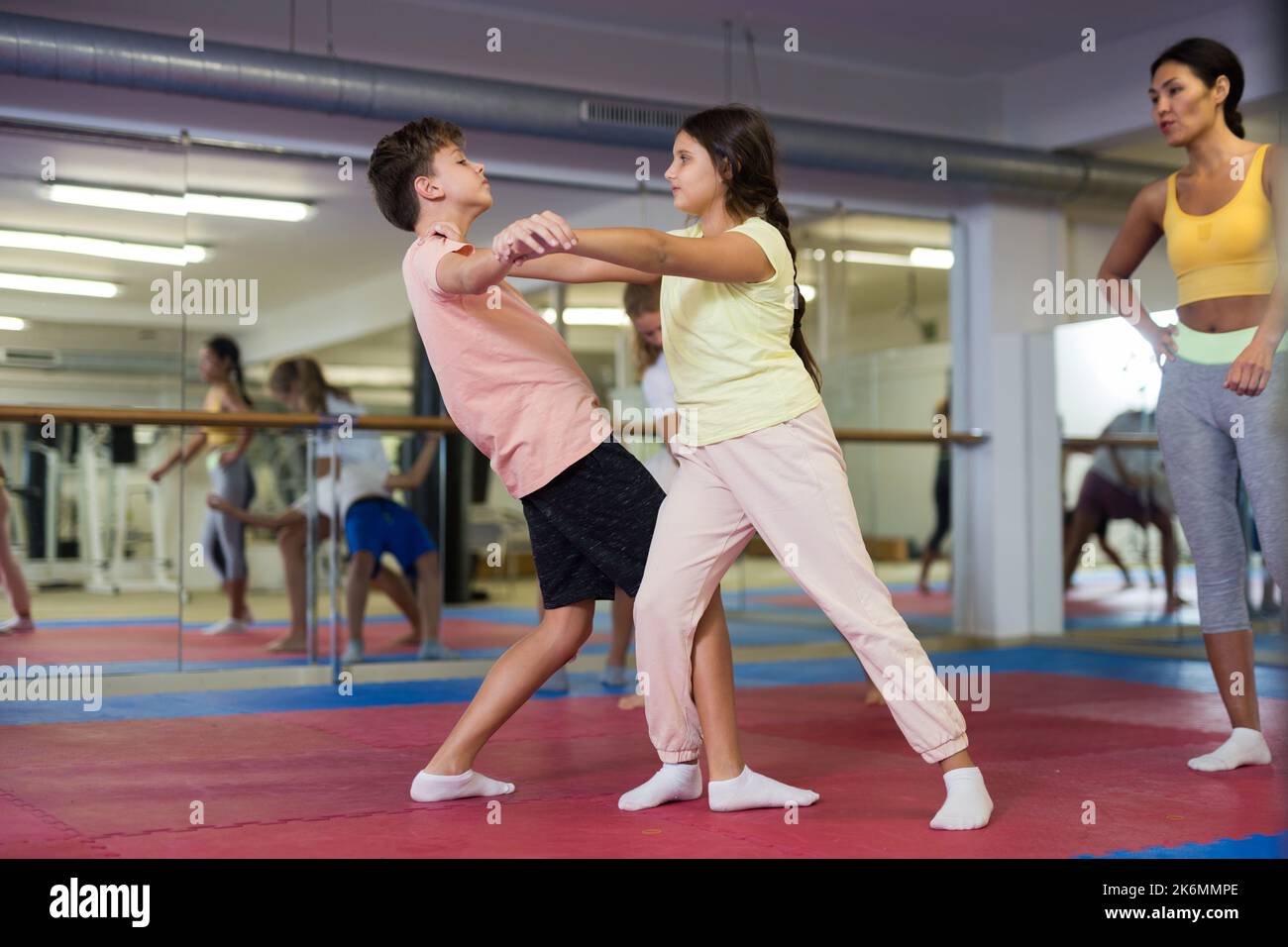 Teenager children practicing new self defense moves Stock Photo - Alamy