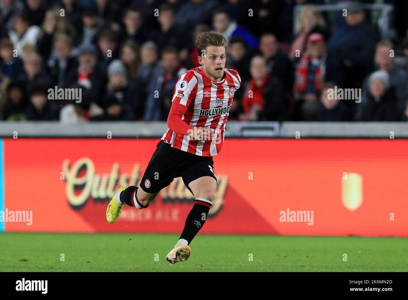 Mathias Jensen #8 of Brentford sprinting during the Premier League ...