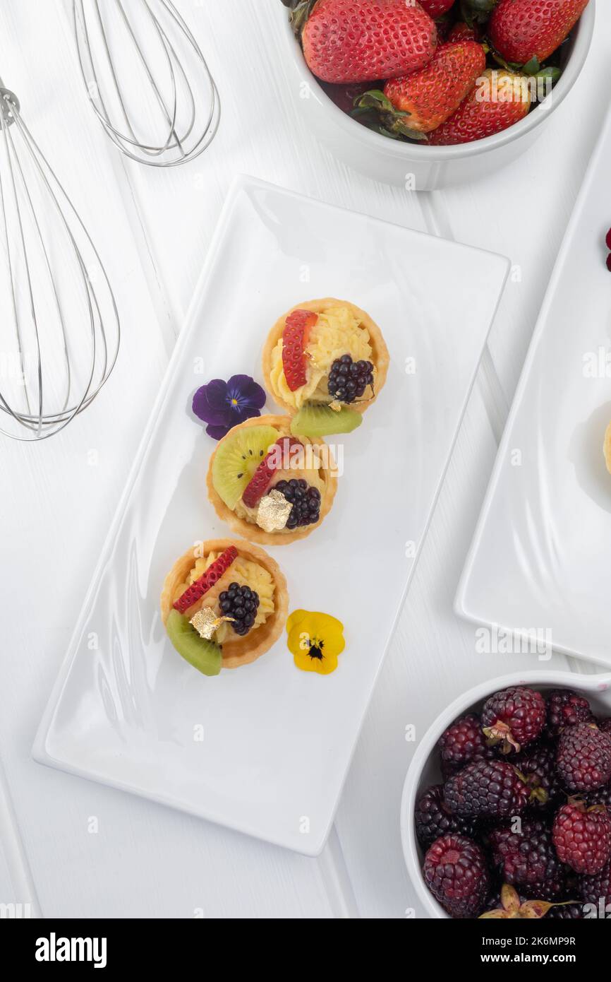 beautiful cake decoration in studio, kitchen utensil for mixing on the ...