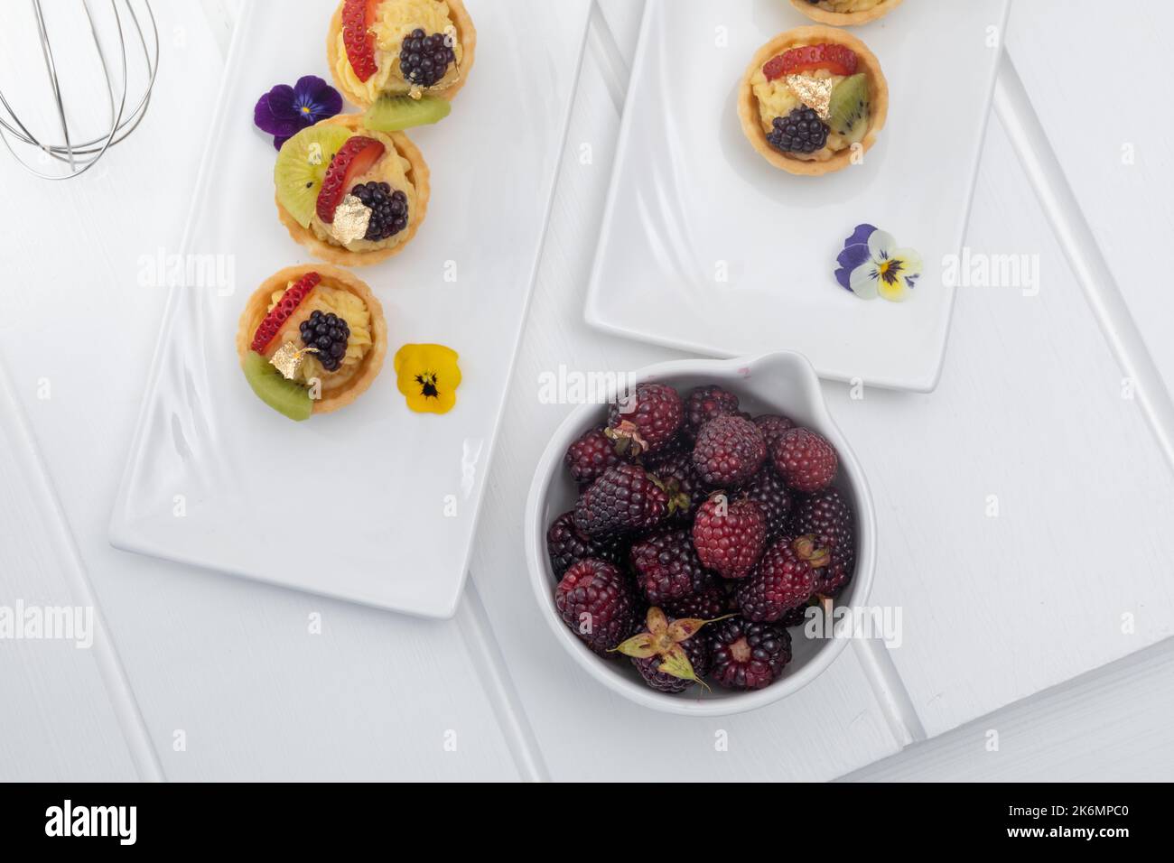 cake in studio, kitchen utensil for mixing on the served table, kitchen ...