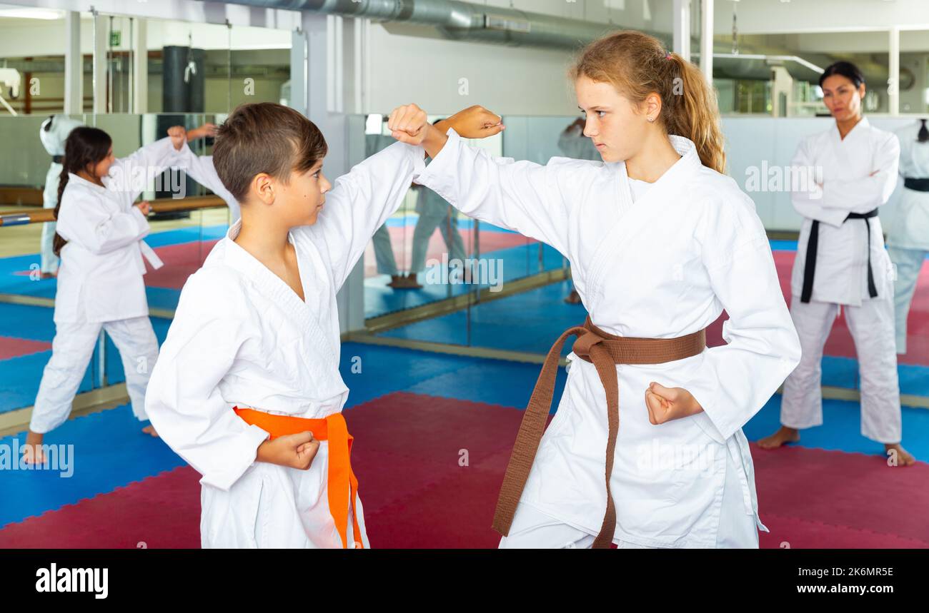 Teenager children practicing new self defense moves Stock Photo - Alamy